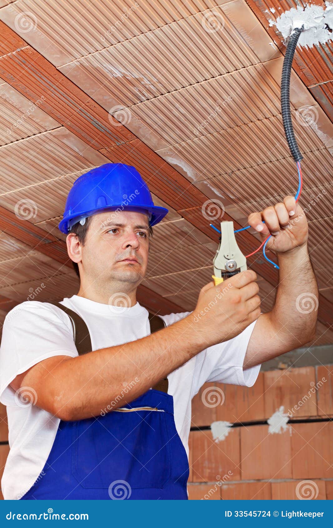 Electrician Working with Wiring in a New Building Stock Photo - Image ...