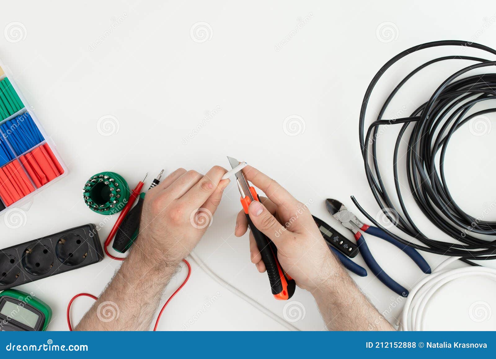 Electrician Works with a Tool on a White Background Stock Photo - Image ...