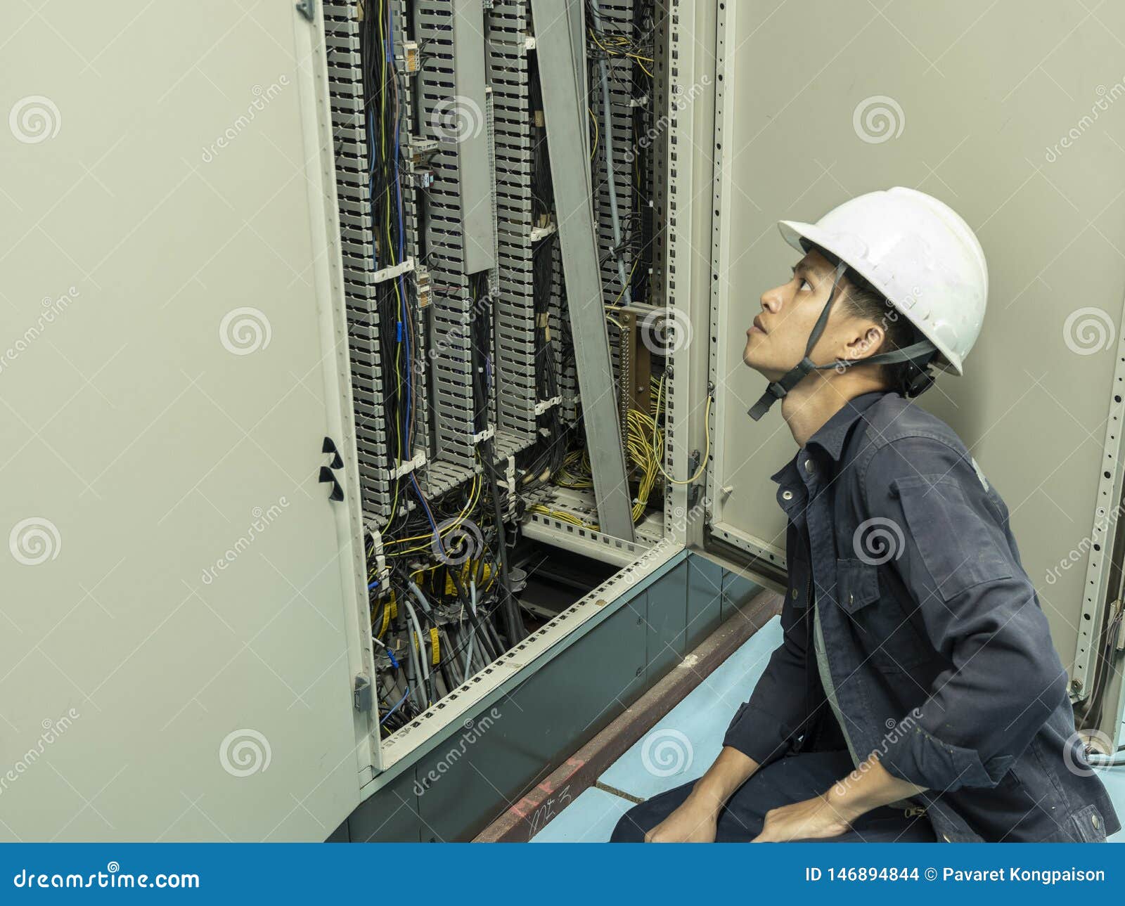 Electricians are Checking Electrical Control Panels in Industrial ...