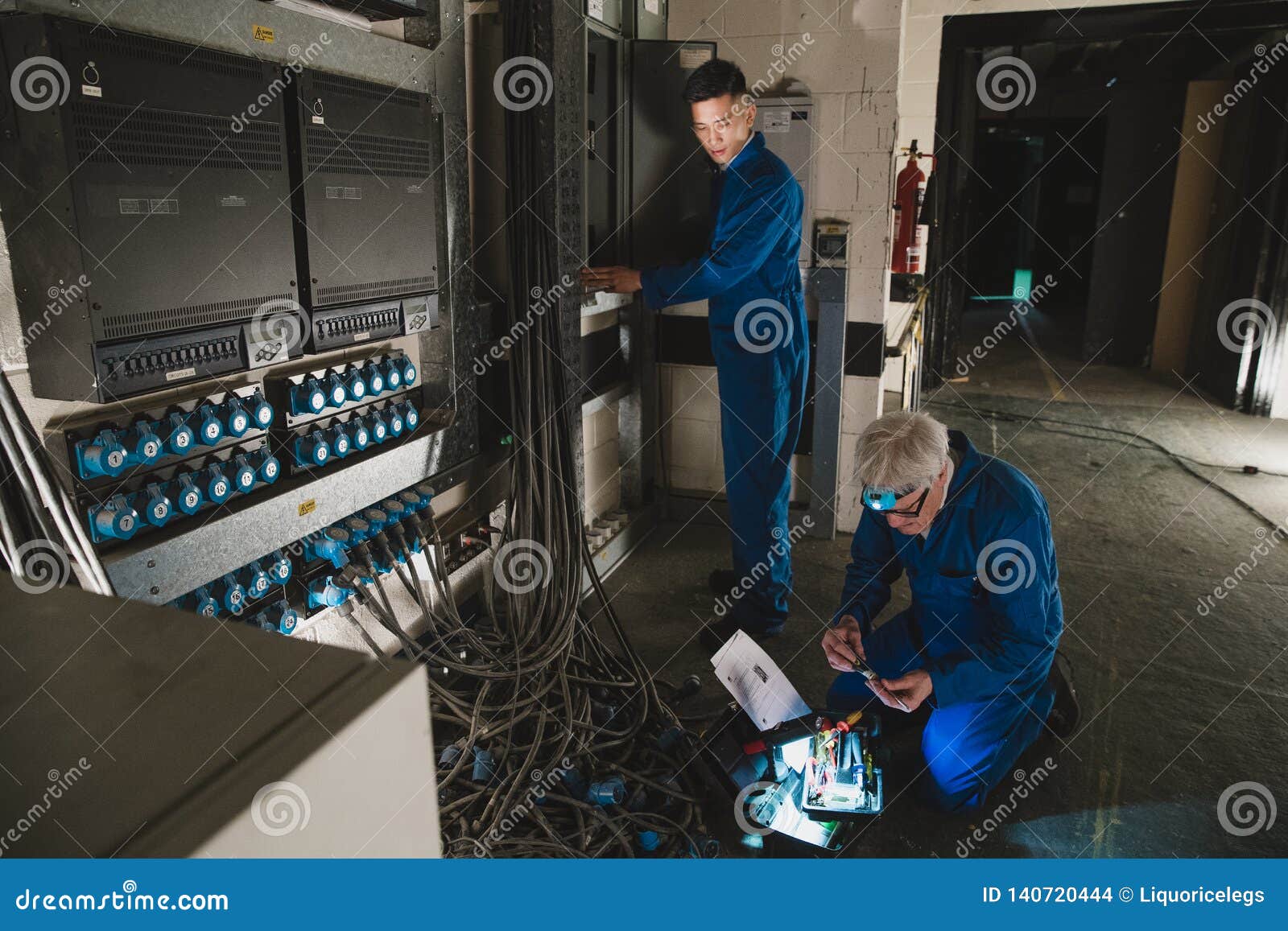 Electricians Fixing a Switch Board Stock Photo - Image of component ...
