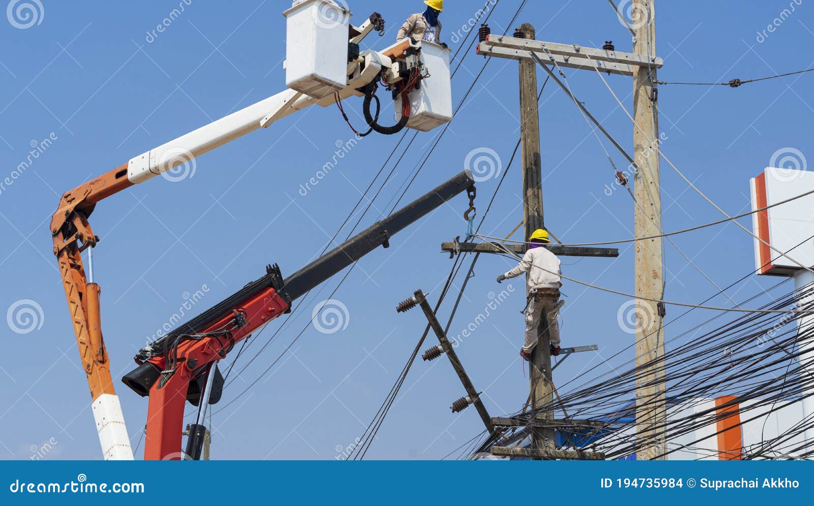 Electricians And Engineer Working To Repair The Power Line With A Cable ...