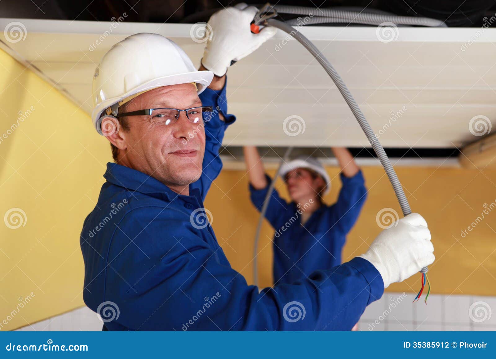 Electricians at work stock photo. Image of profession - 35385912