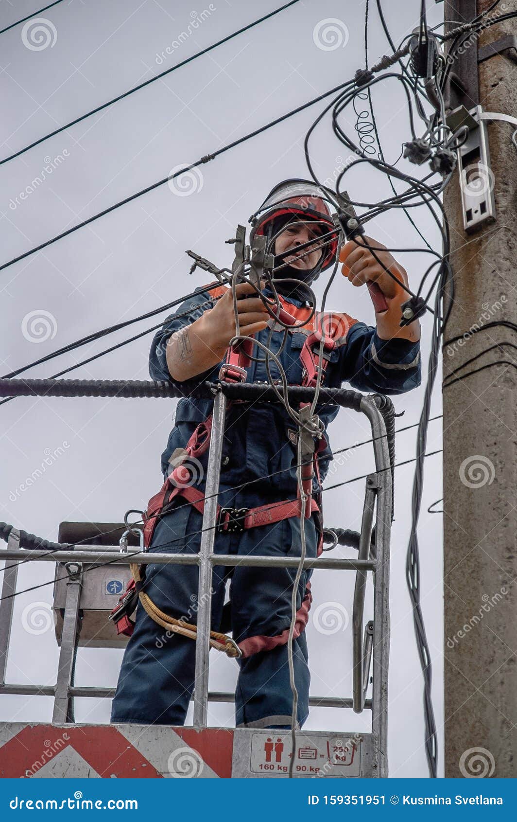 Electricians Work on Inspection and Replacement of Lighting Poles ...