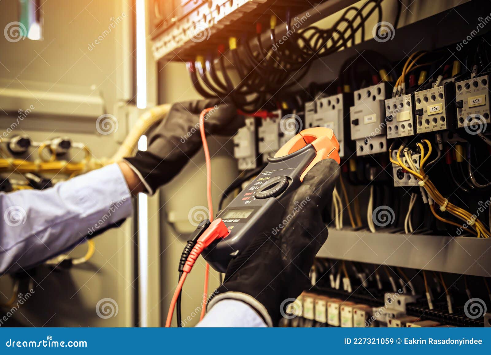 Engineer Using Measuring Equipment Checking Electric Current Voltage at ...