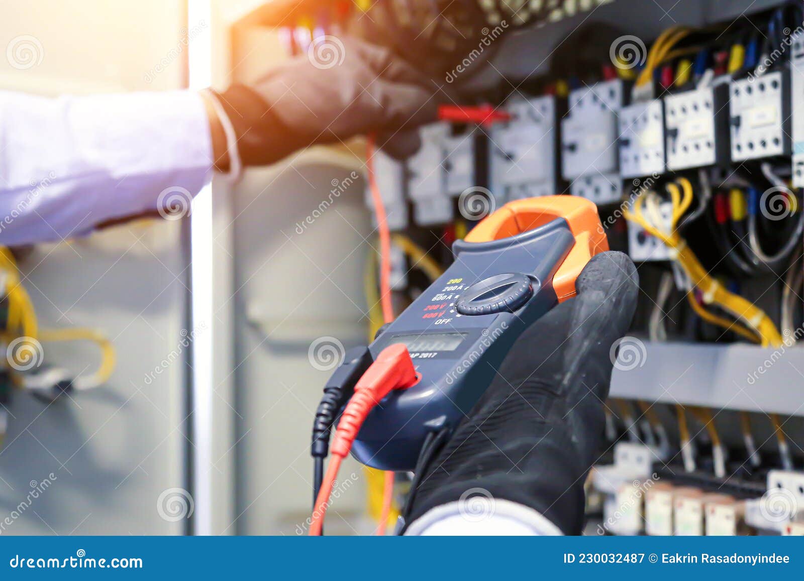 Engineer Using Measuring Equipment Checking Electric Current Voltage at ...