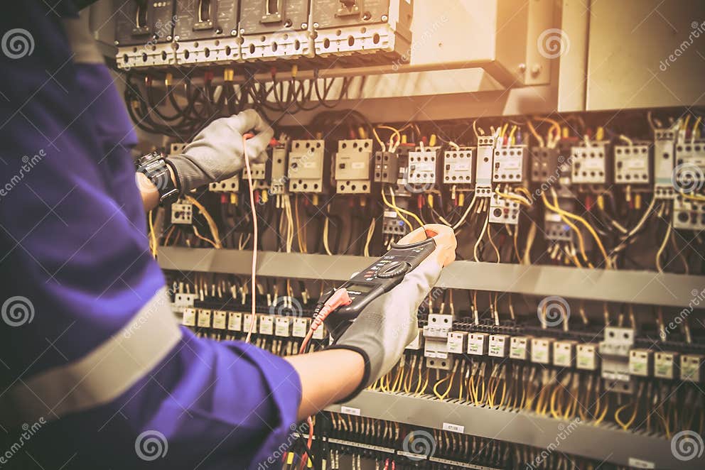 Engineer Using Measuring Equipment Tool Checking Electric Current ...