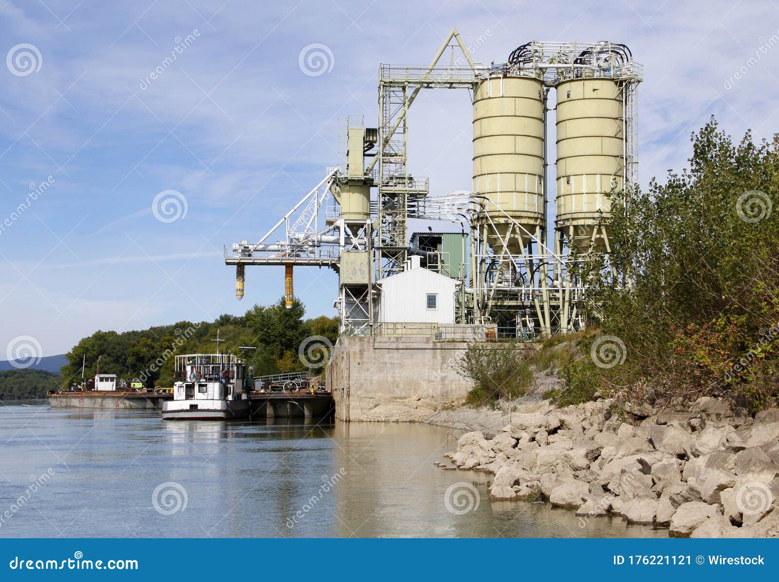 Electricity Generators Next To a River Surrounded by Trees and Grass ...