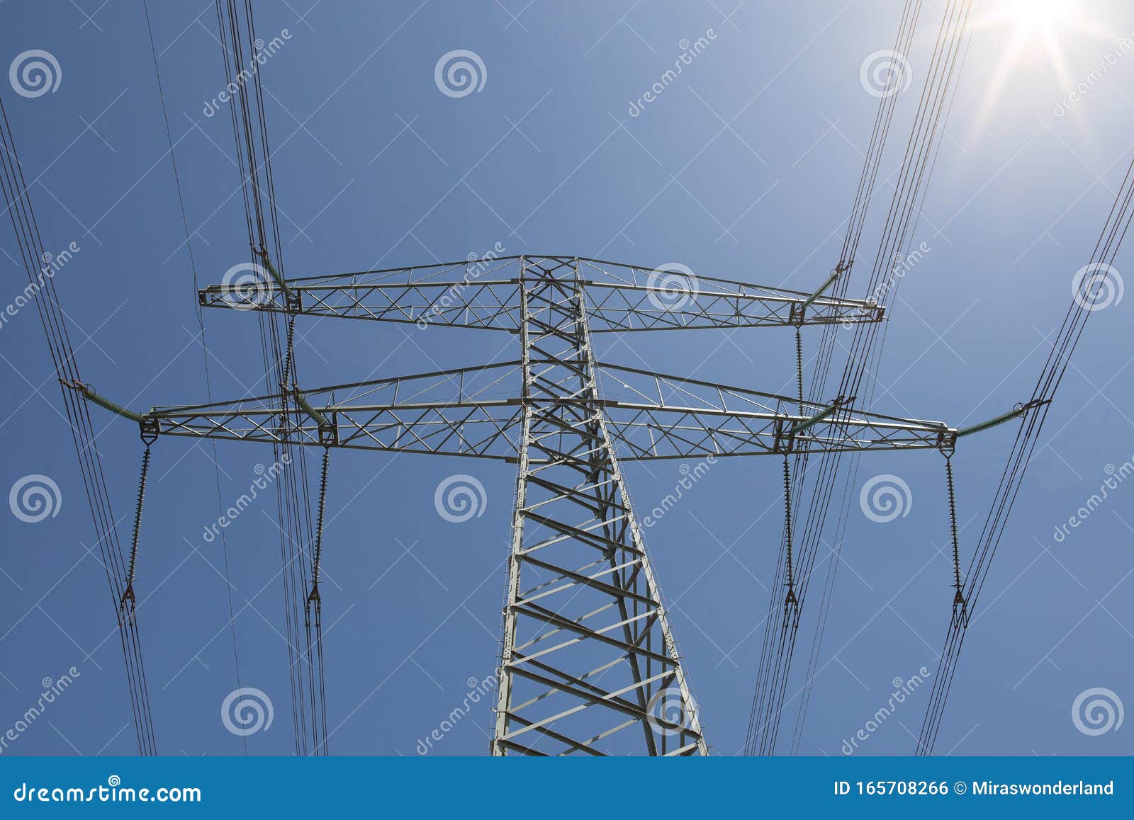 Electricity Mast And Transmission Towers On The Background On A Blue ...