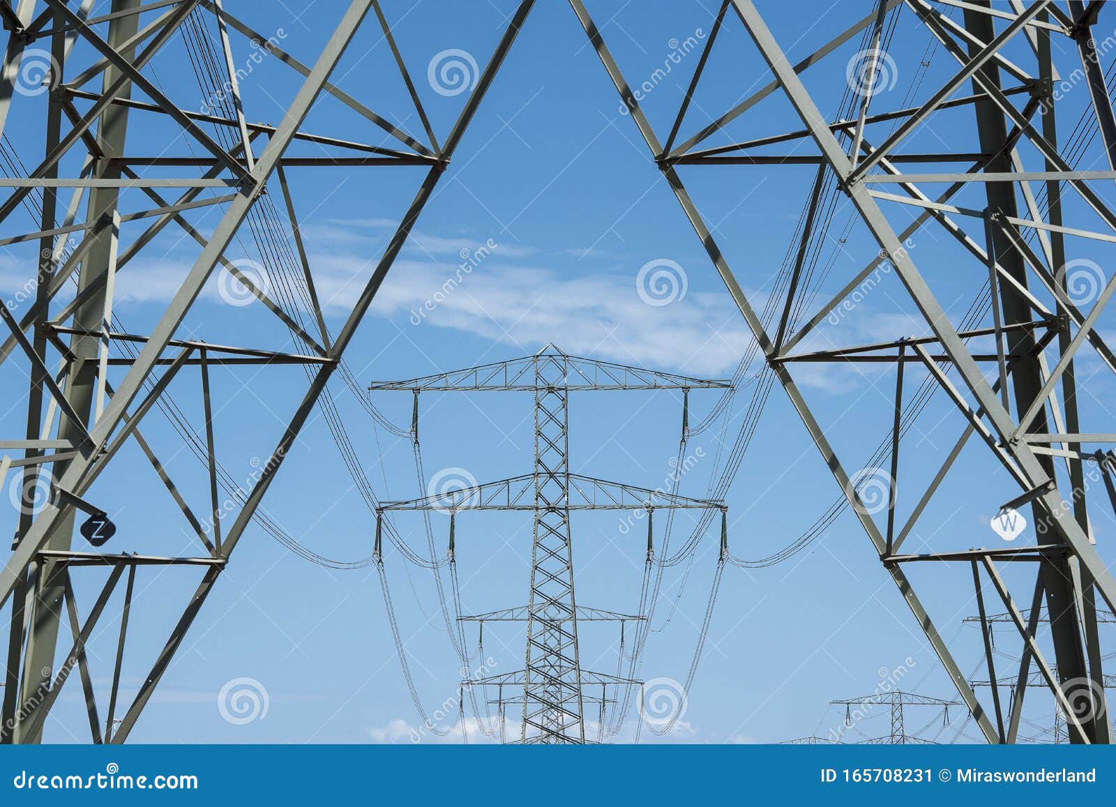 Electricity Mast and Transmission Towers on the Background on a Blue ...