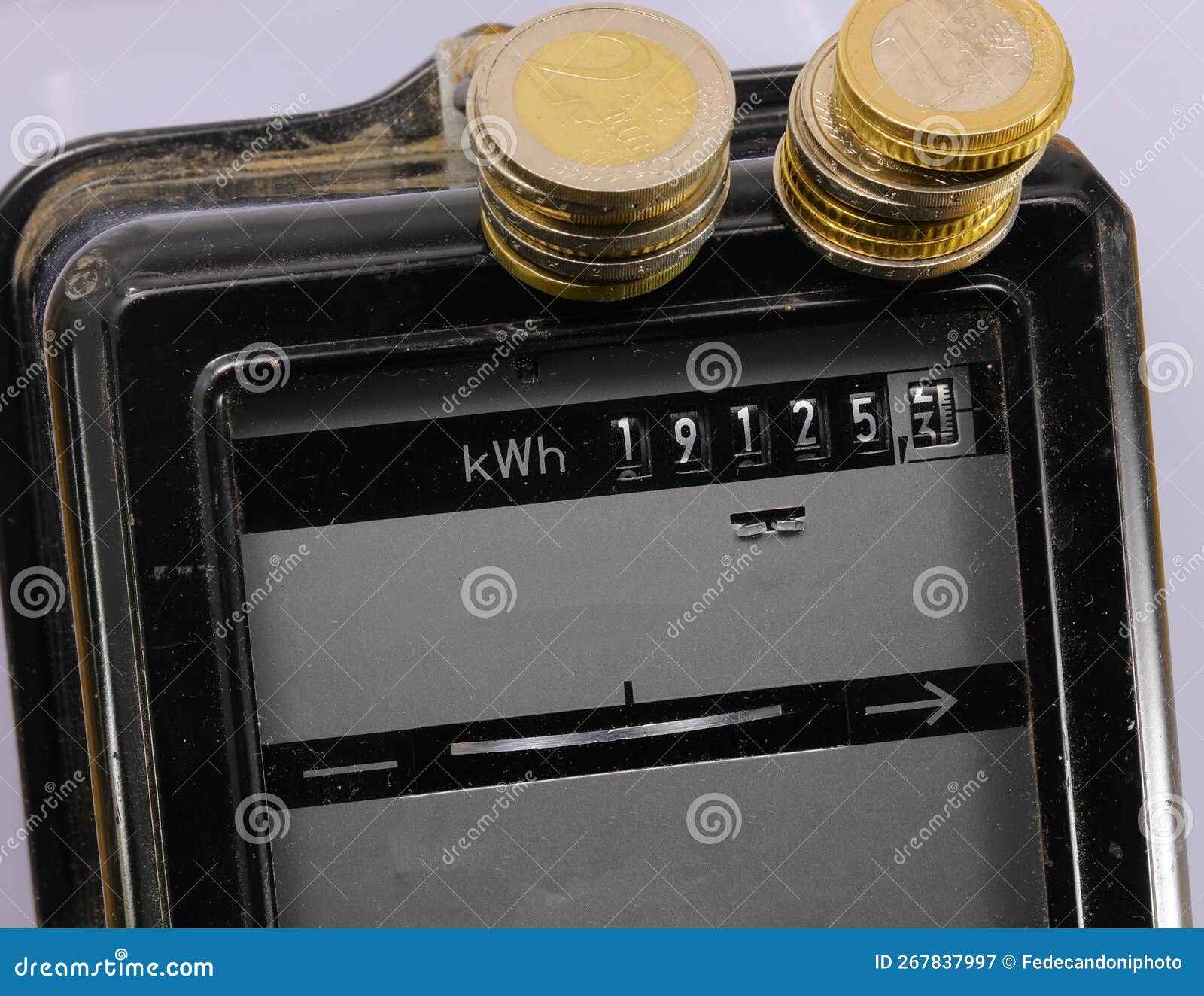 Electricity Meter and the Euro Coins Above with the Text KWH Stock ...