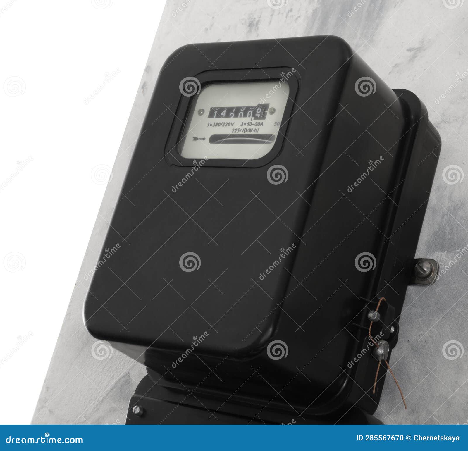 Electricity Meter on Light Grey Wall Against White Background. Space ...