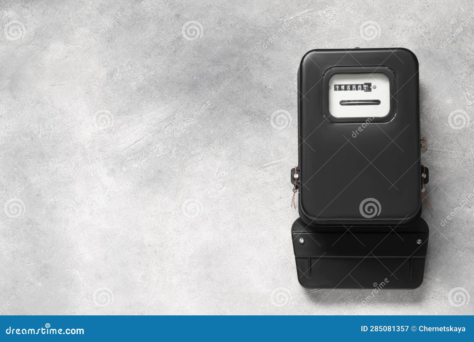 Electricity Meter on Light Grey Wall, Space for Text Stock Image ...