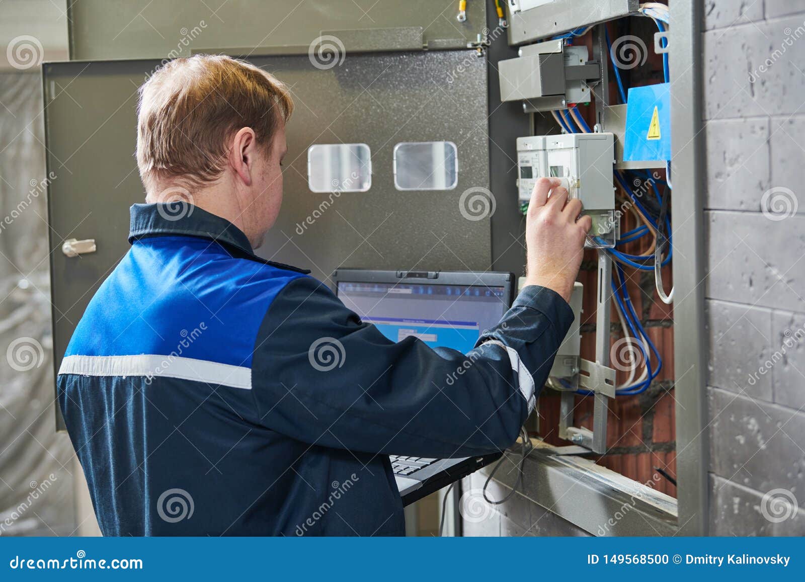 Electricity Power Control and Metering. Worker Checks Data Stock Photo ...