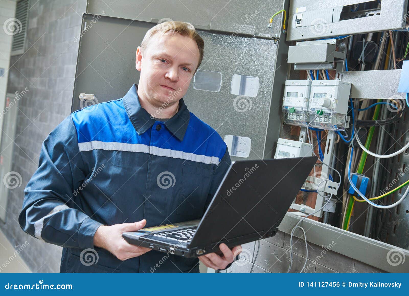 Electricity Power Control and Metering. Worker Collects Data Stock ...