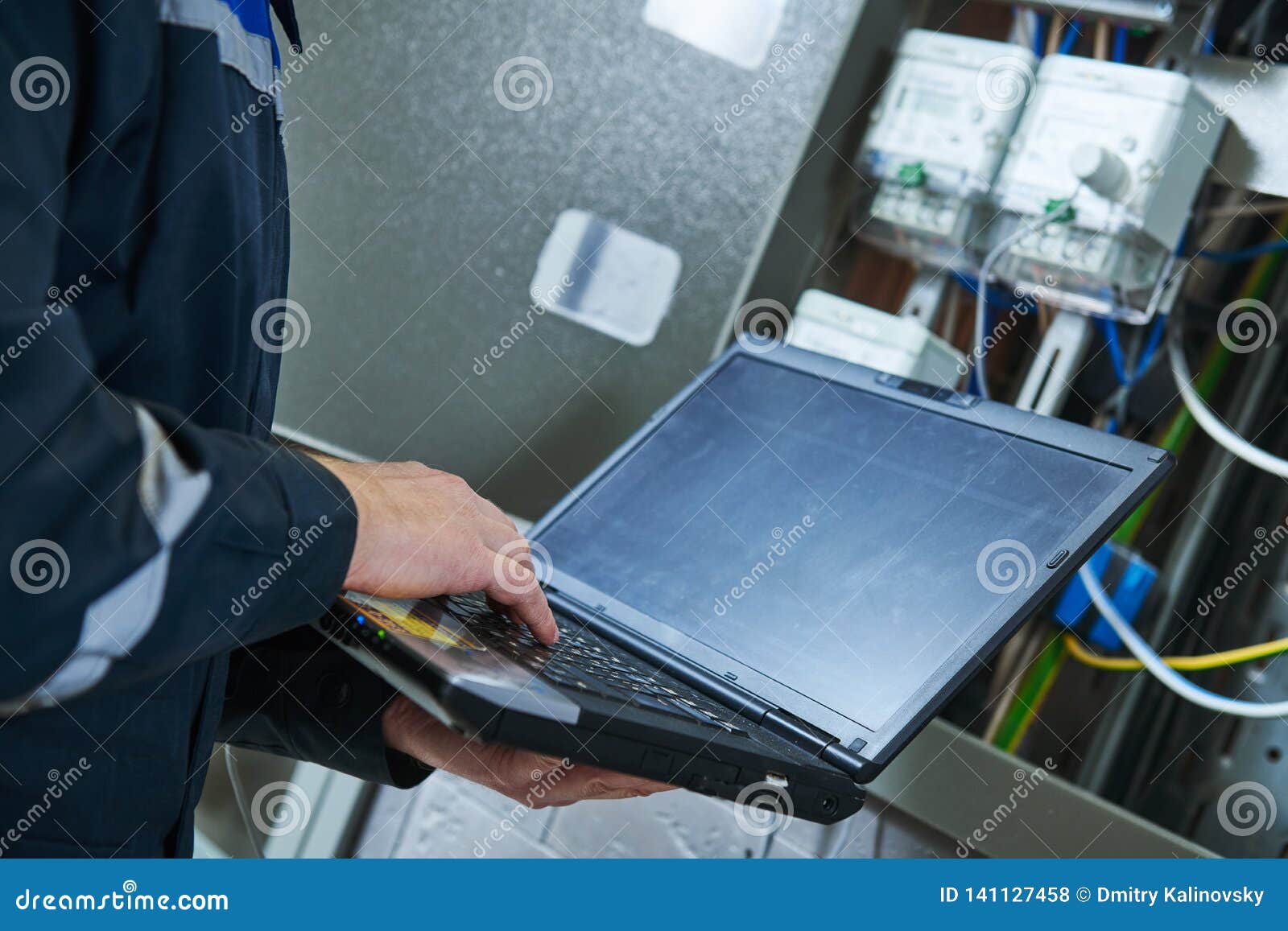 Electricity Power Control and Metering. Worker Collects Data Stock ...