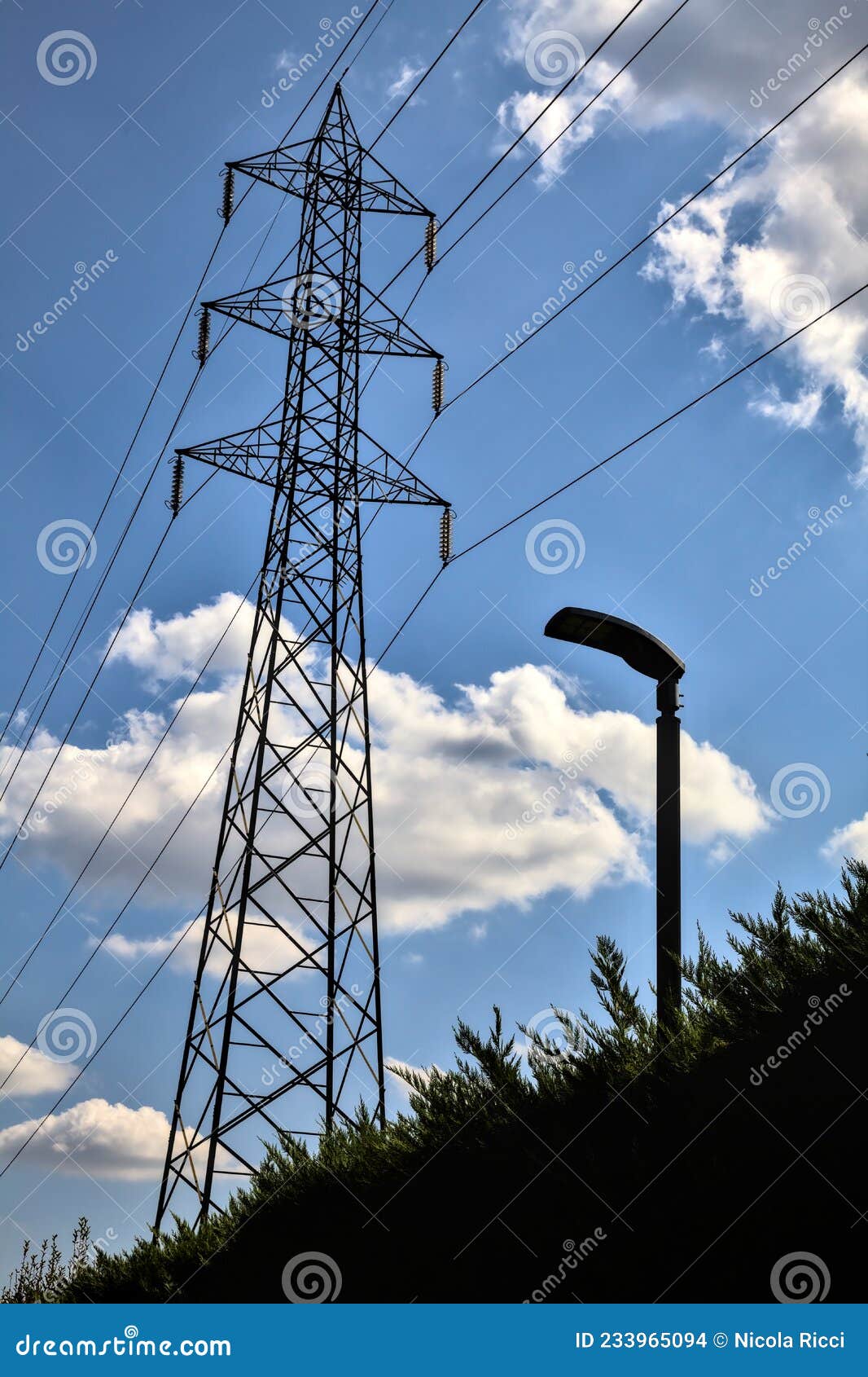 Electricity Pylon and a Lamp Light on a Clear Sky with Clouds As ...