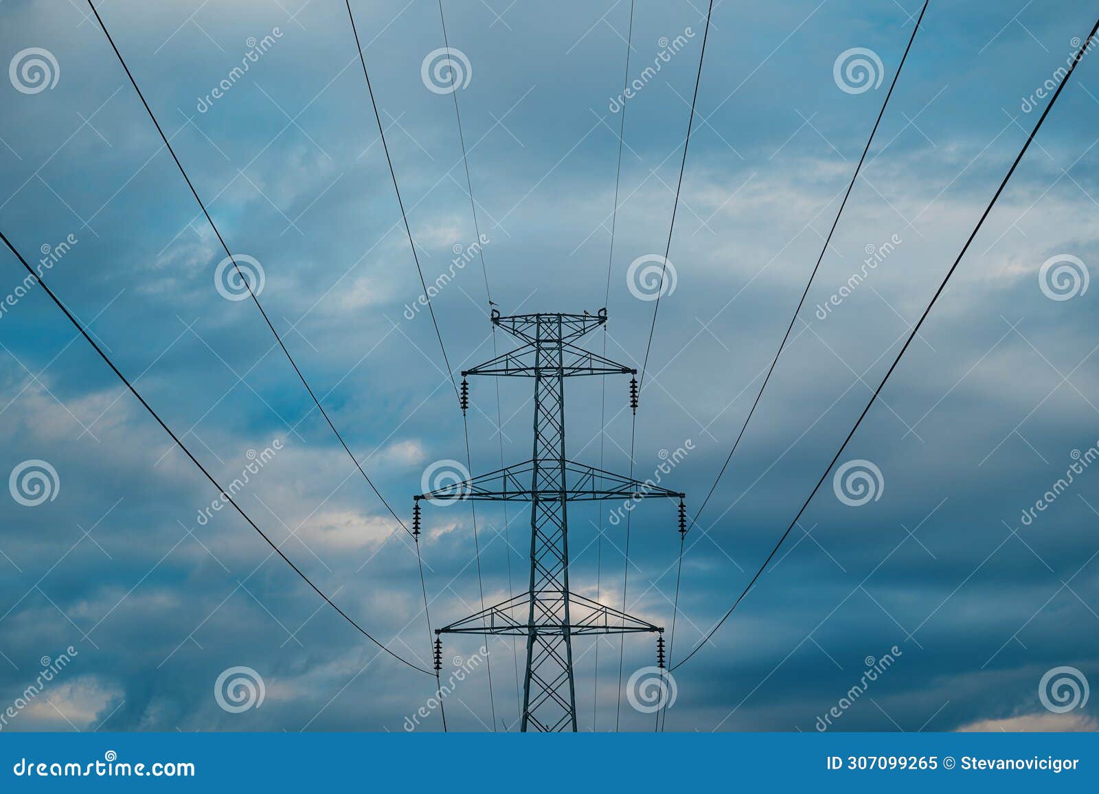 Electricity Pylon with Overhead Powerline Cables Against Cloudy Sky ...