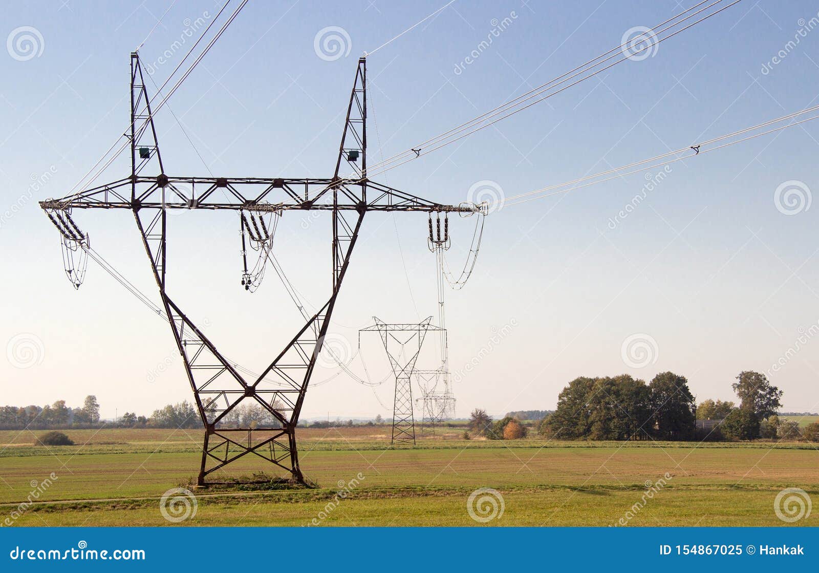 Electricity Pylons in a Field Stock Image - Image of voltage ...