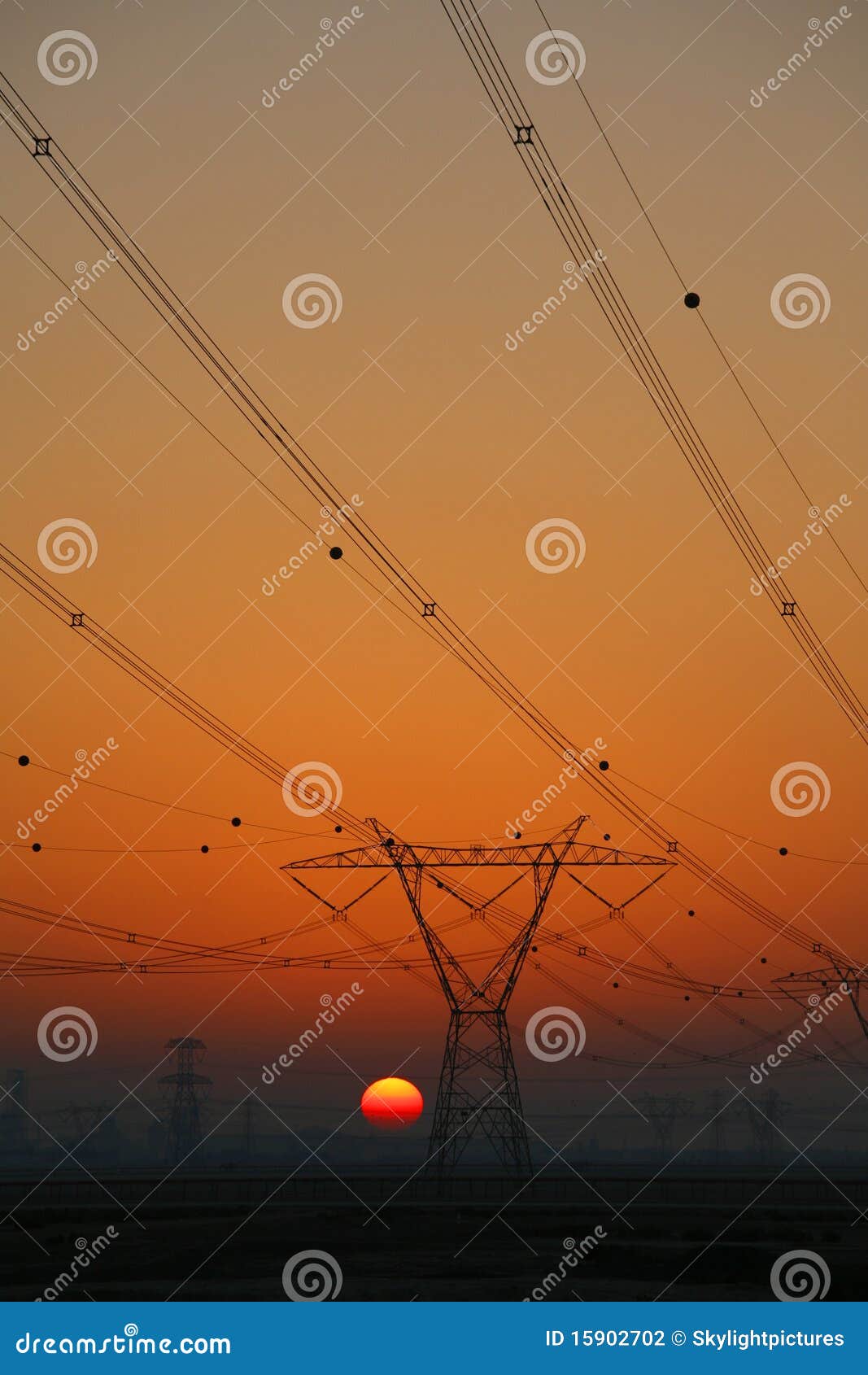 Electricity Pylons with Setting Sun Stock Photo - Image of power ...