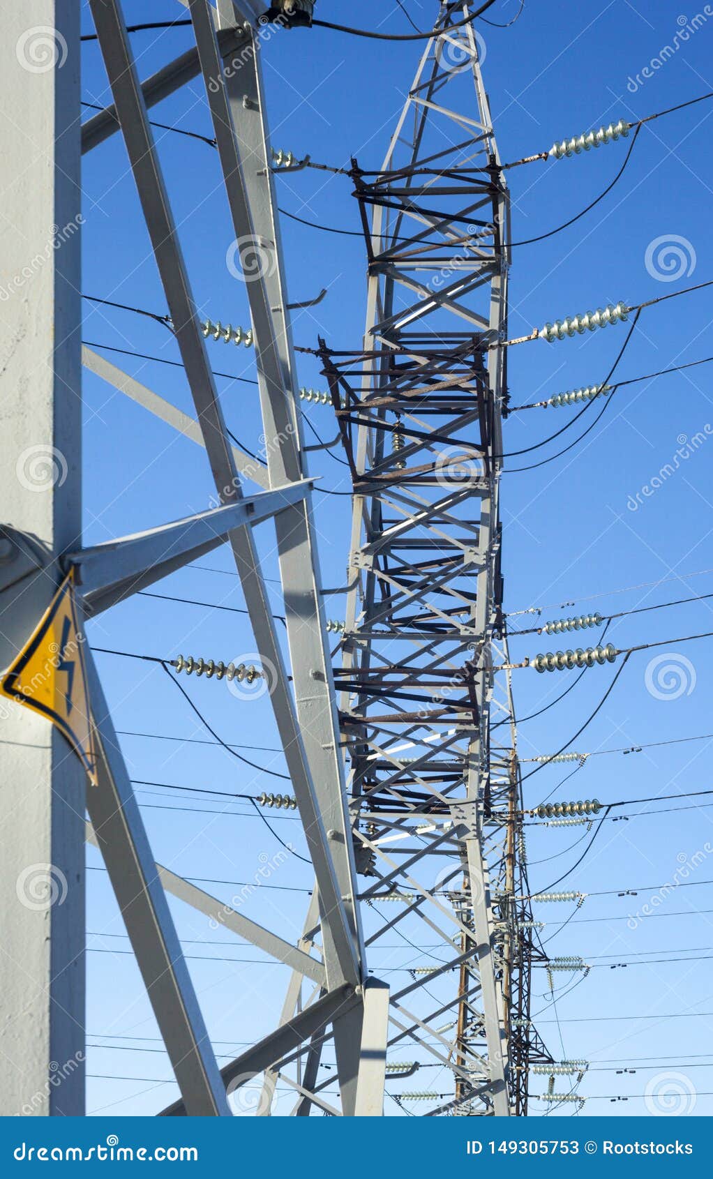 Electricity Pylons with Warning High Voltage Sign Stock Image - Image ...