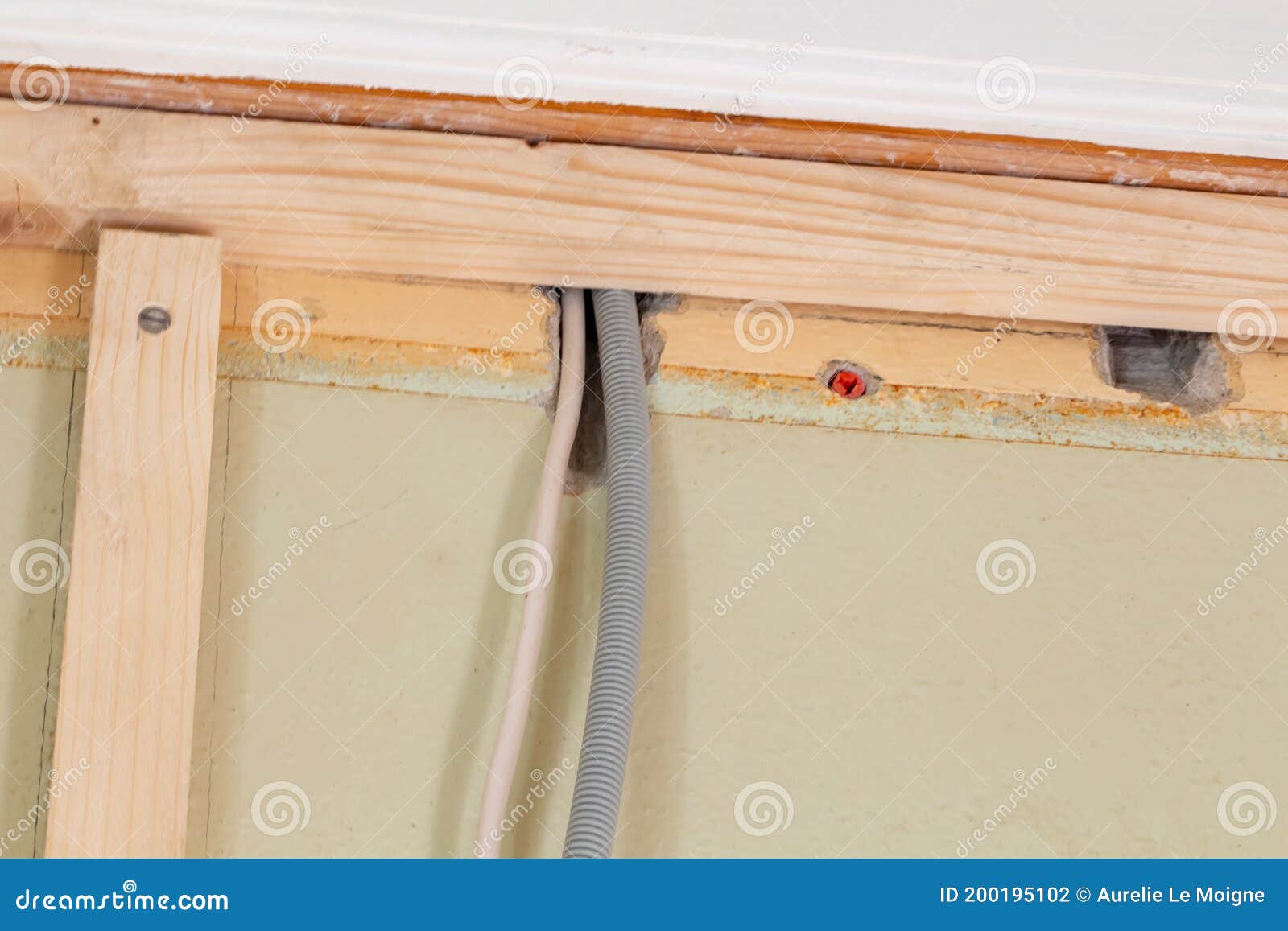 Electricity work in a wall stock photo. Image of material - 200195102