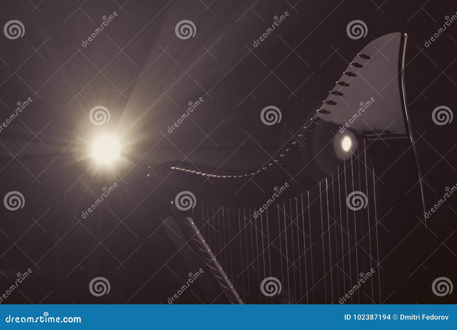 Electro Harp in the Rays of Light Stock Photo - Image of orchestral ...