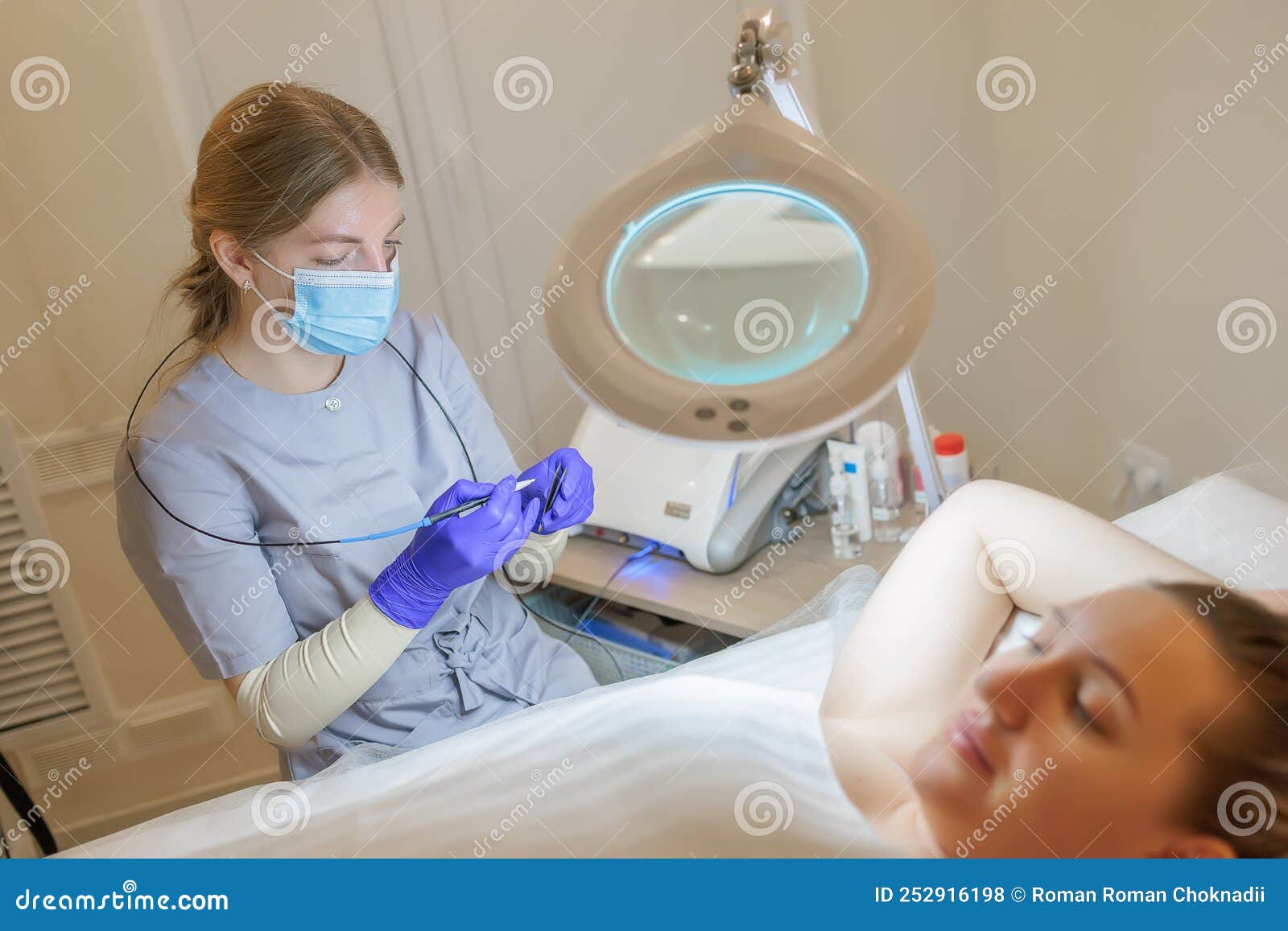 The Electroepilation Master Sits Opposite the Client and Prepares for ...