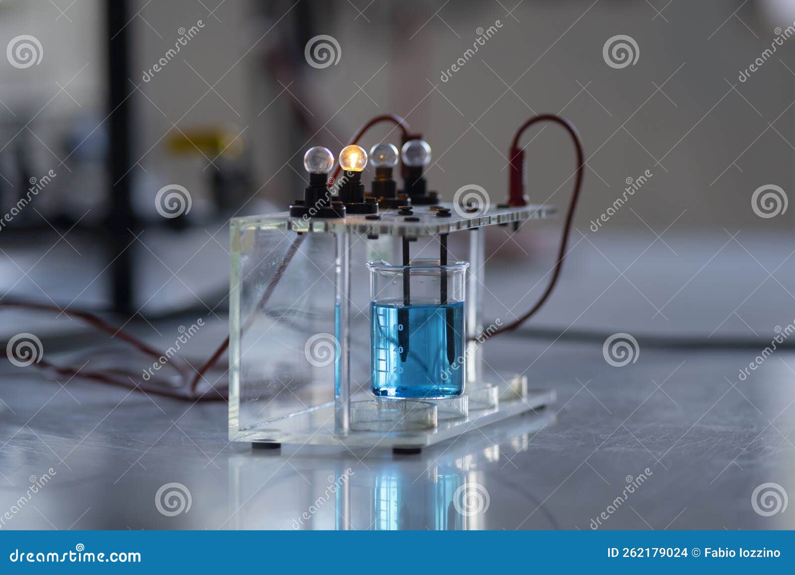 Electrolyte Solution Turns on a Light Bulb. Experiment in the Chemistry ...