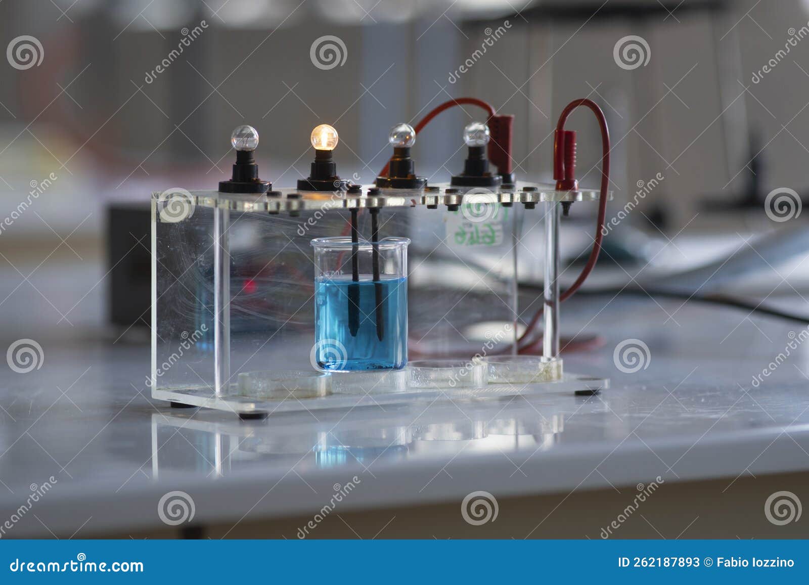 Electrolyte Solution Turns On A Light Bulb. Experiment In The Chemistry ...