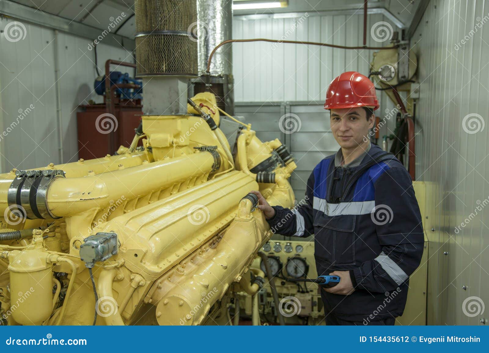 Electromechanic Performs Repair Work on a Diesel Generator Stock Photo ...