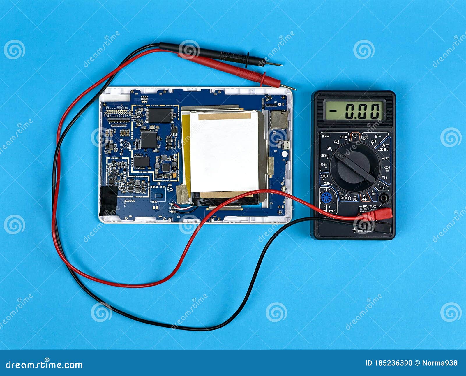 Electronic Board and Multimeter on a Blue Background. Multimeter To ...