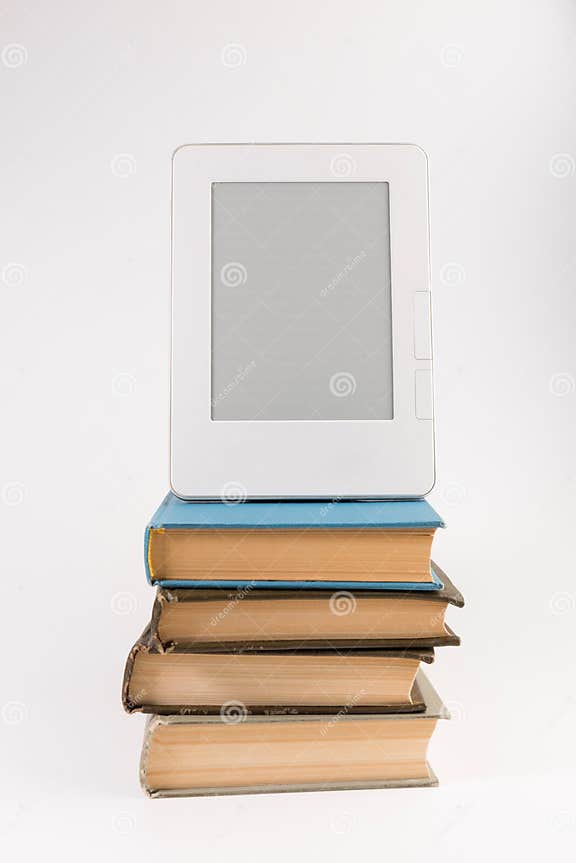 Electronic Book on the Top of the Stack of Regular Old Books Isolated ...