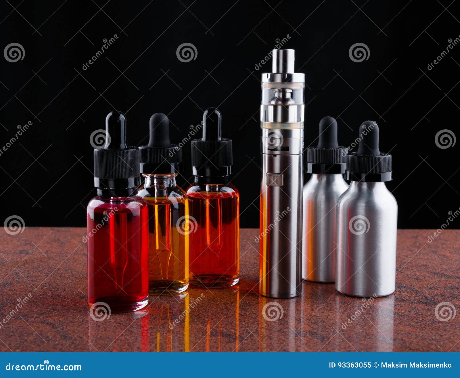 Electronic Cigarette and Bottles with Vape Liquid on Granite Surface ...