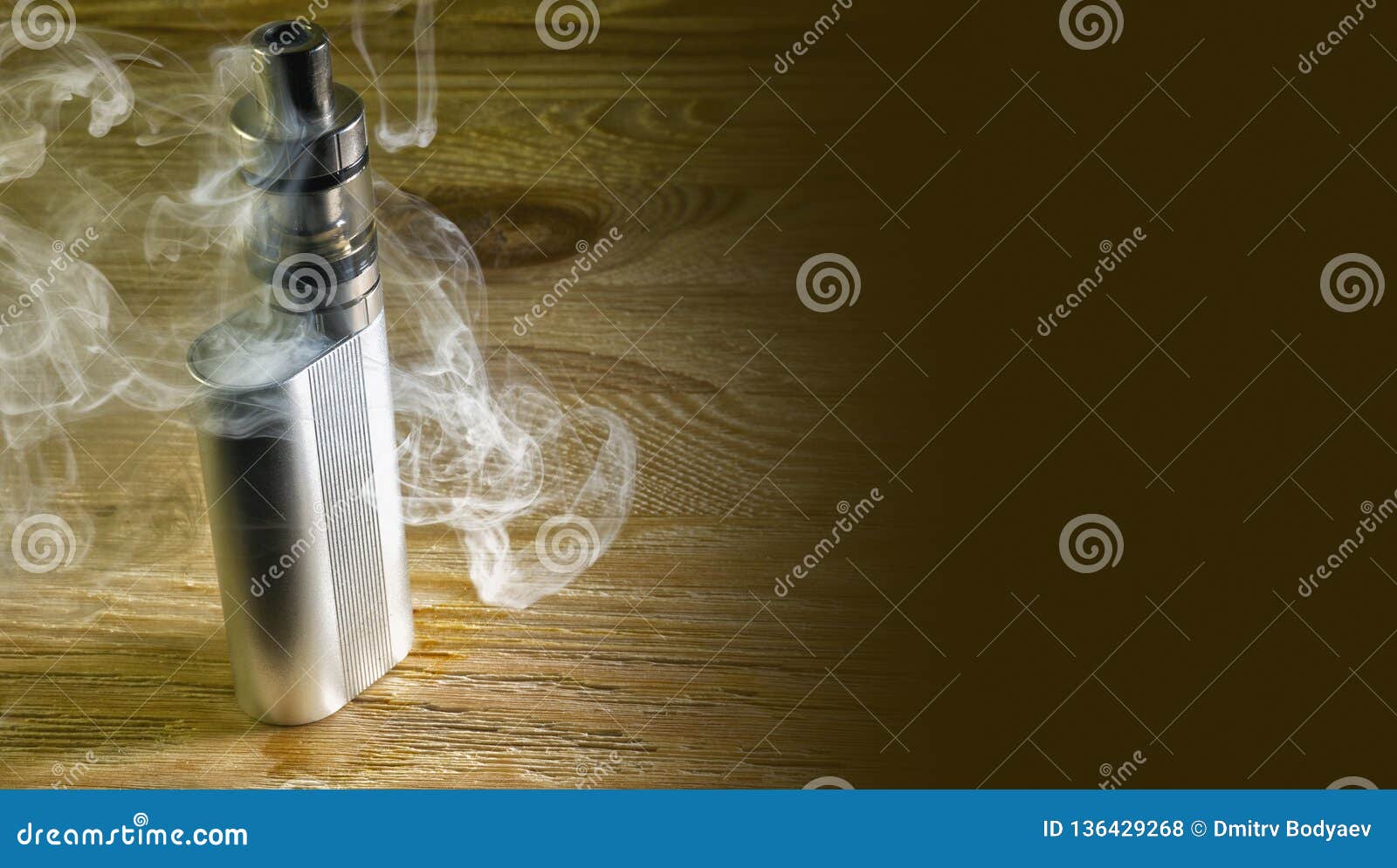 Electronic Cigarette Standing on the Table in a Cloud of Vapor Stock ...