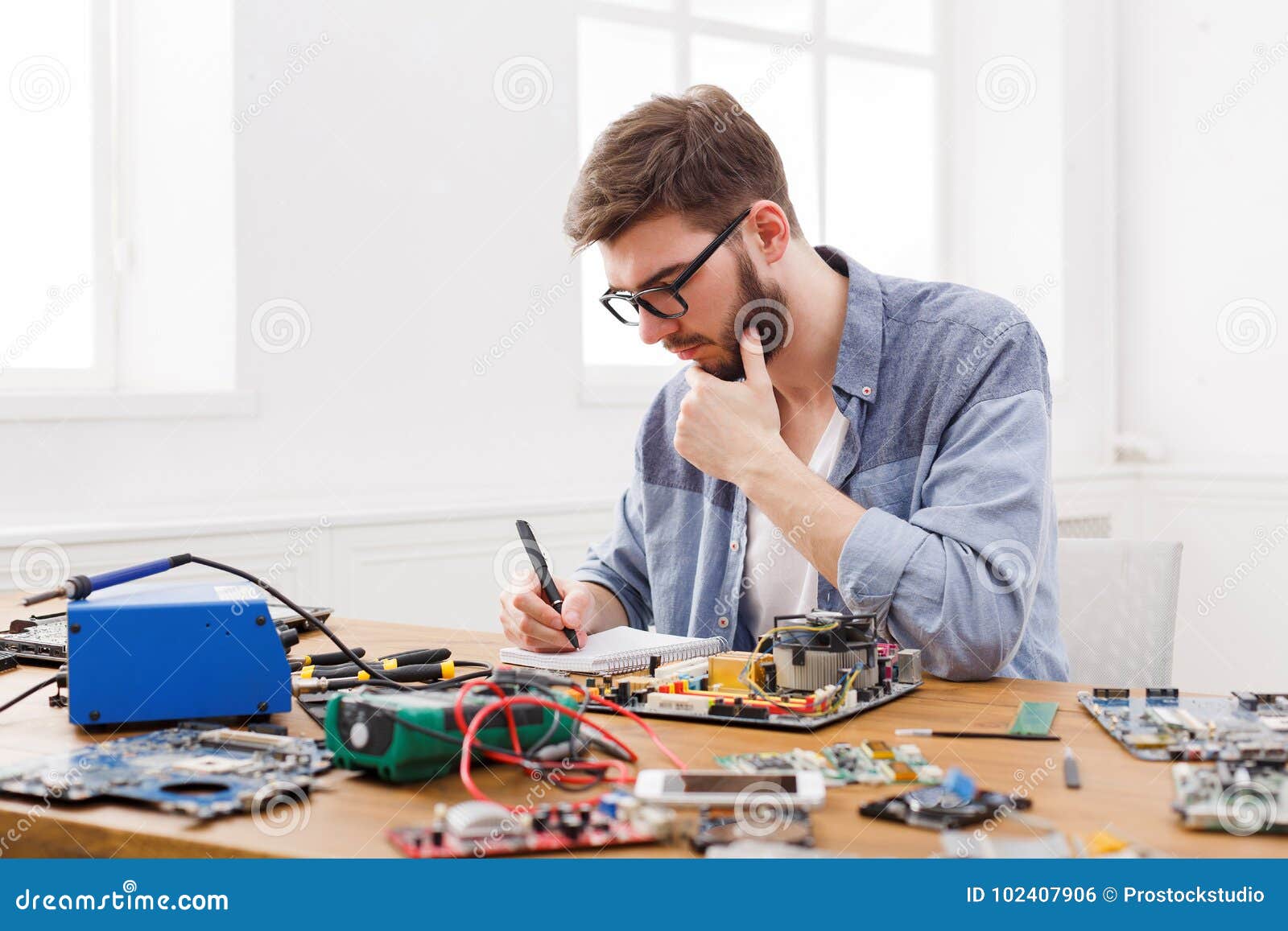 Electronic Circuit Board Inspecting in Repair Shop Stock Photo - Image ...