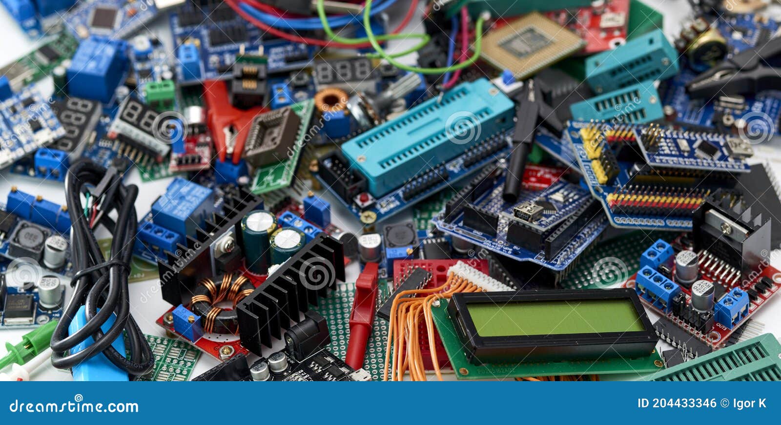 Arduino And Programmers With Peripherals And Expansion Boards Lie On A ...