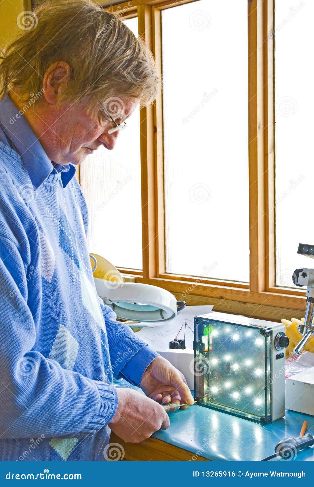 Electronic Engineer Tests a Light Source. Stock Photo - Image of ...