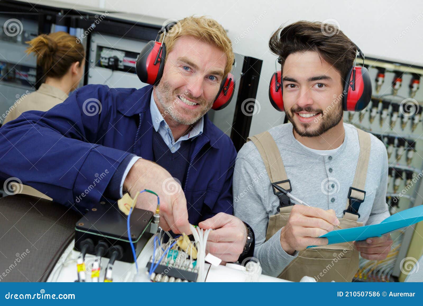 2 Electronic Engineers Looking at Camera Stock Photo - Image of ...