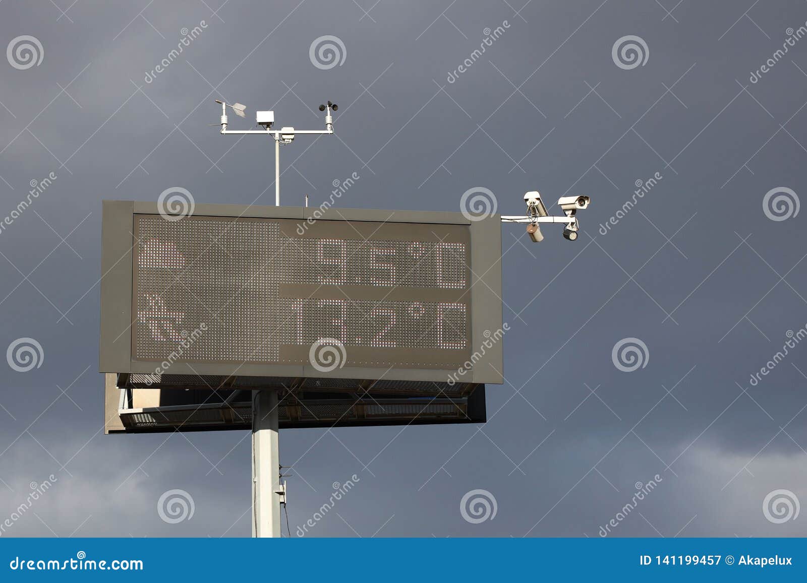 Electronic Information Board Measuring Temperature Against the Backdrop of Thunderclouds ...