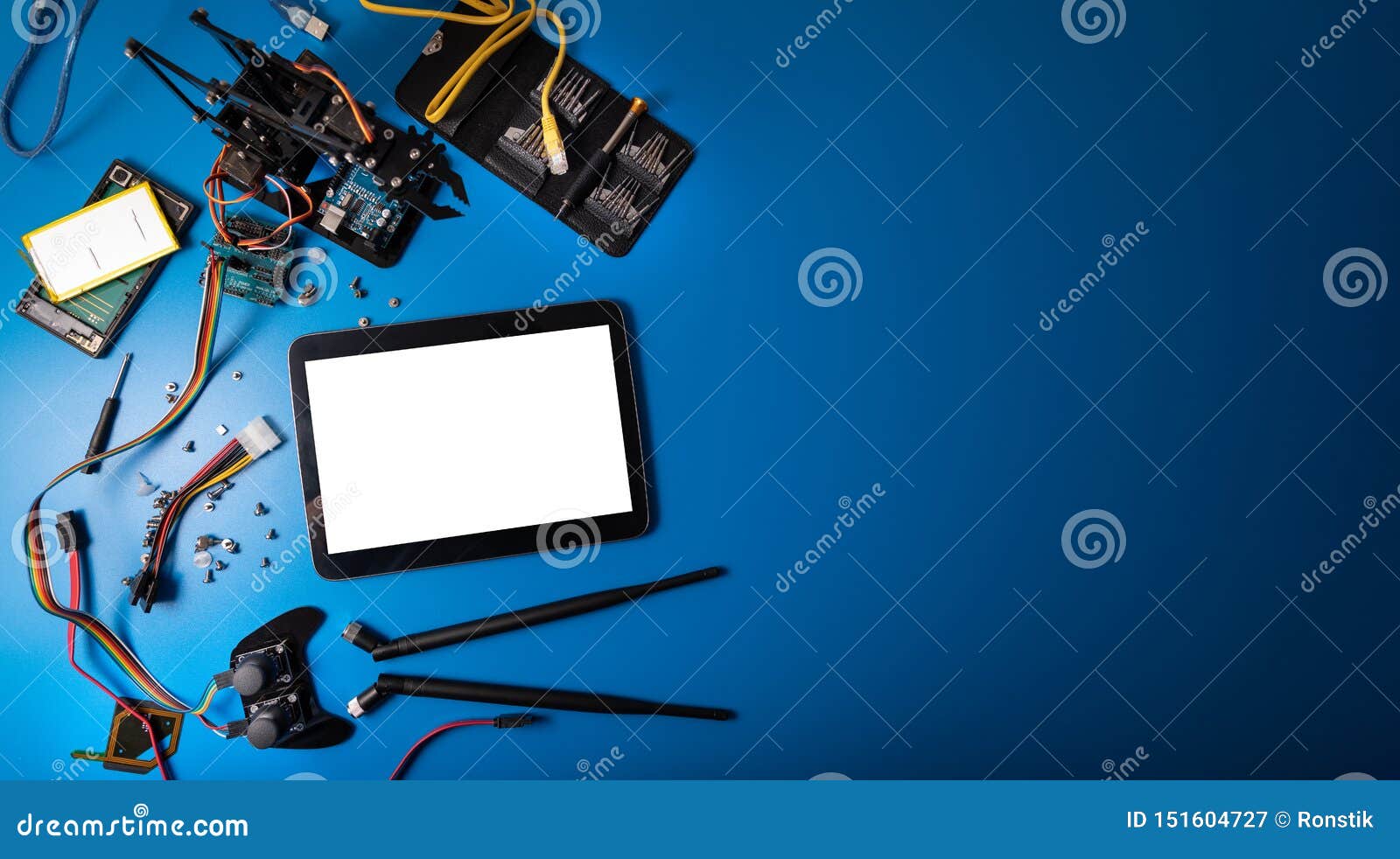 Electronic Items and Digital Tablet with Blank Screen on Blue ...