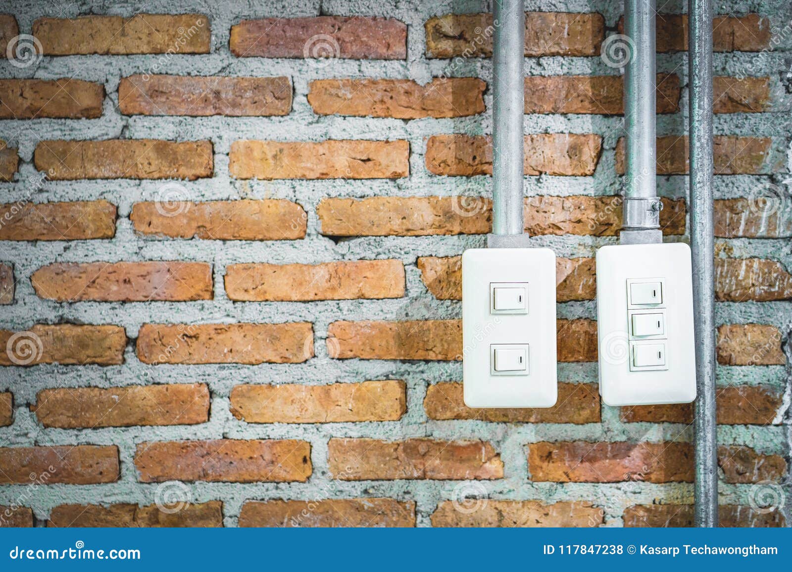 Electronic Light Switch and Metal Pipe on Red Brick Wall . Copy Stock ...