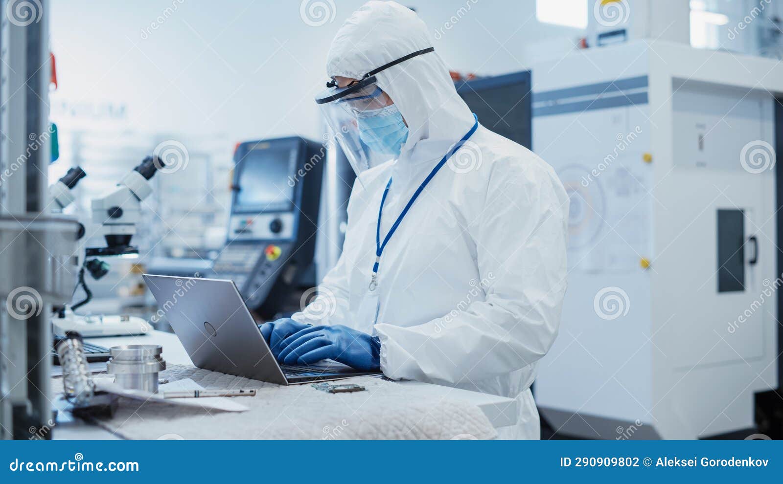 Electronic Manufacturing Factory: Engineer in Sterile Coverall Working ...