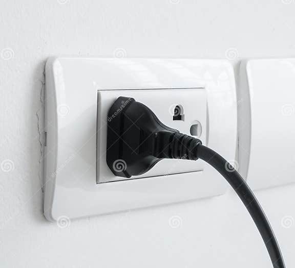 Electronic Power Plug Plugged in a Wall Socket Stock Image - Image of ...