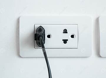 Electronic Power Plug Plugged in a Wall Socket Stock Photo - Image of ...