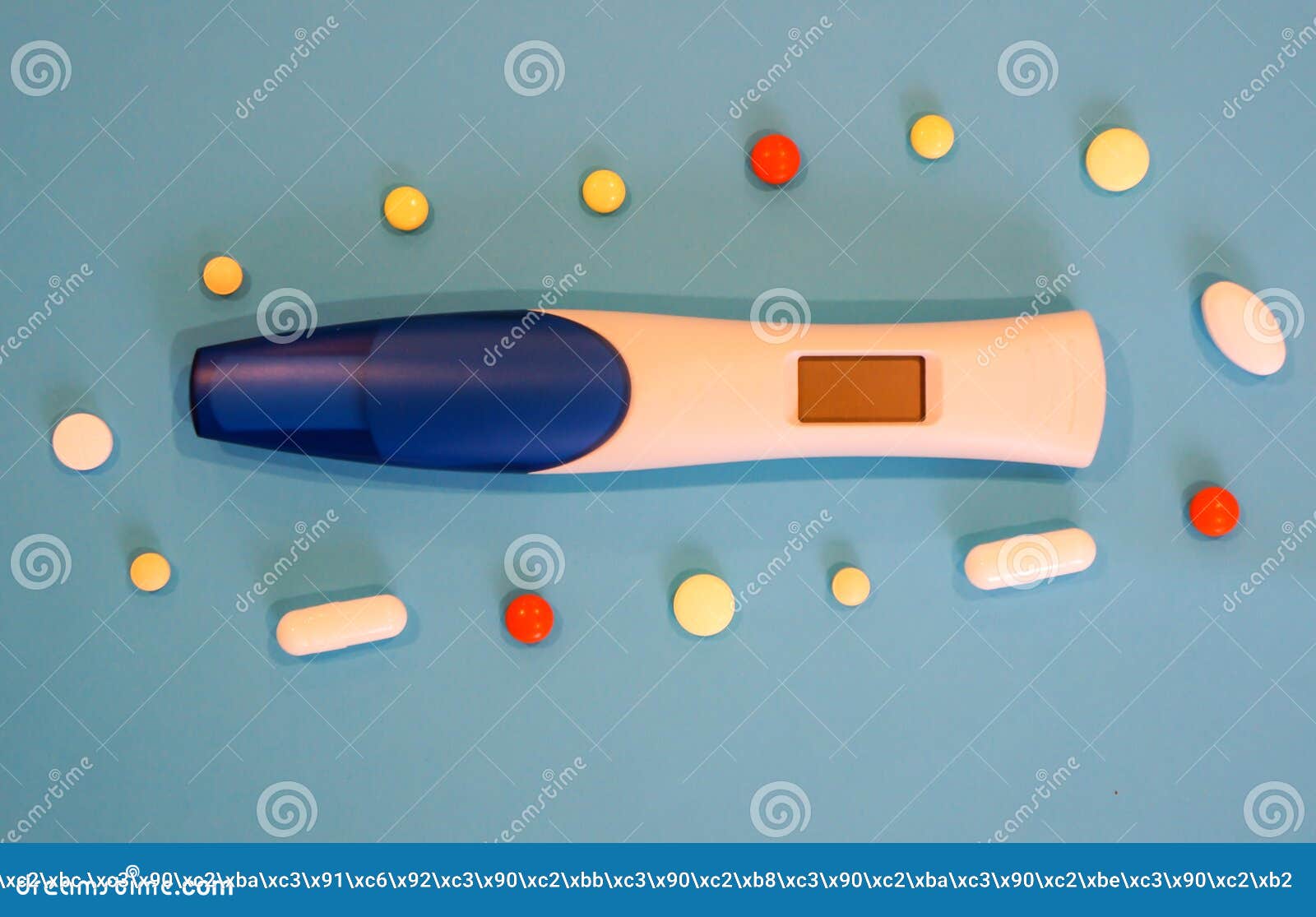 Electronic Pregnancy Test Surrounded by Multi-colored Pills of Various ...
