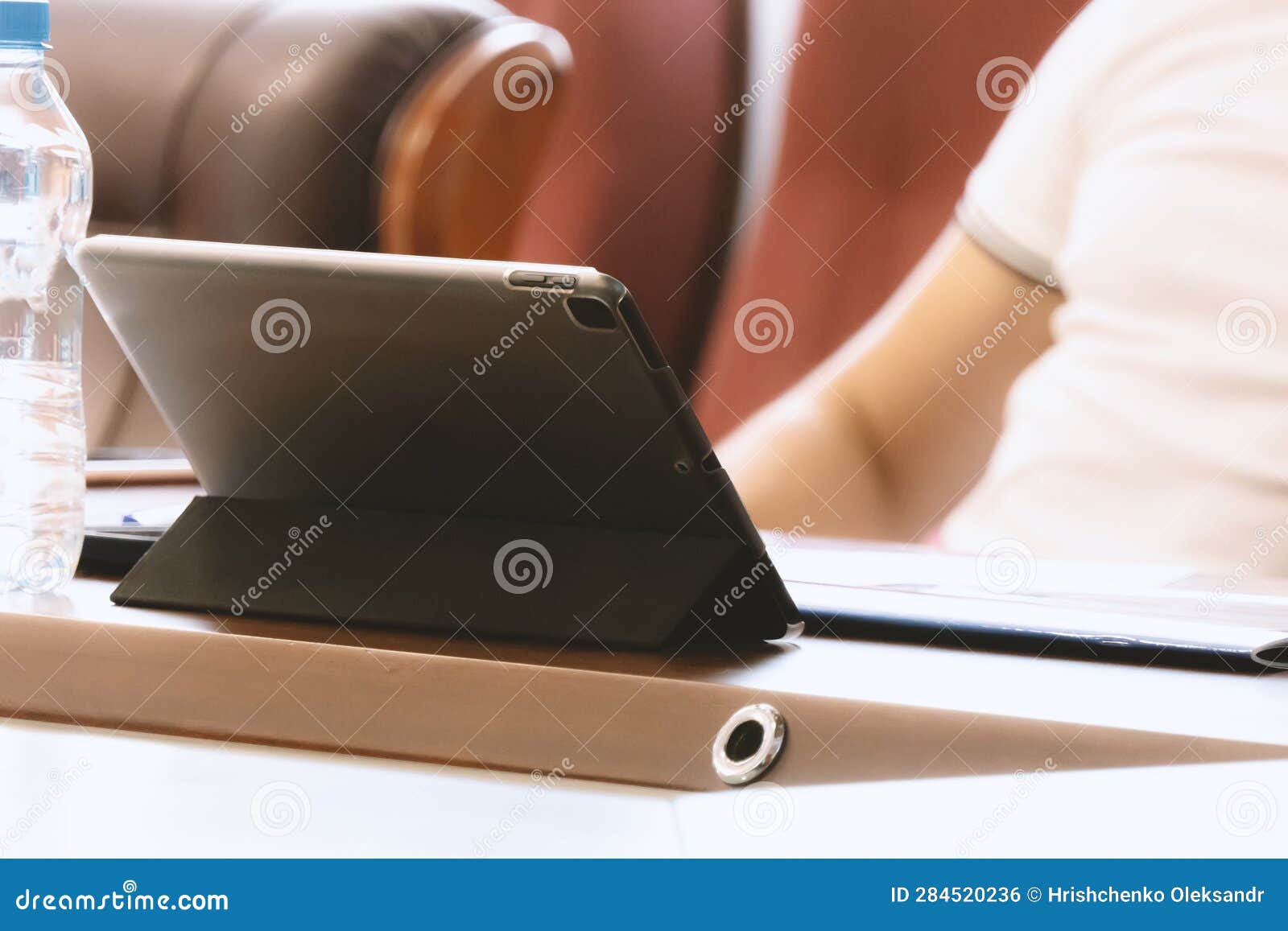 The Electronic Tablet is on the Table in Front of the Man Stock Photo ...
