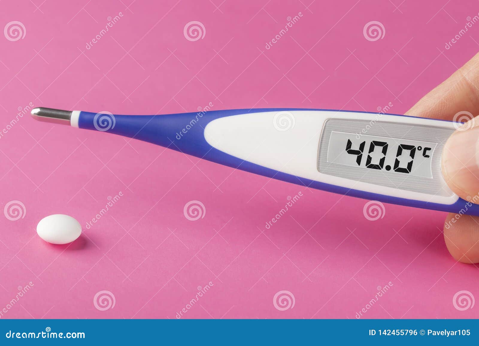 Electronic Thermometer and Pill on a Pink Background. High Temperature ...