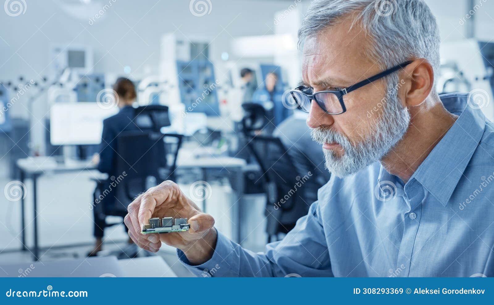 Electronics Design Factory Office: Electrical Engineer Working on ...