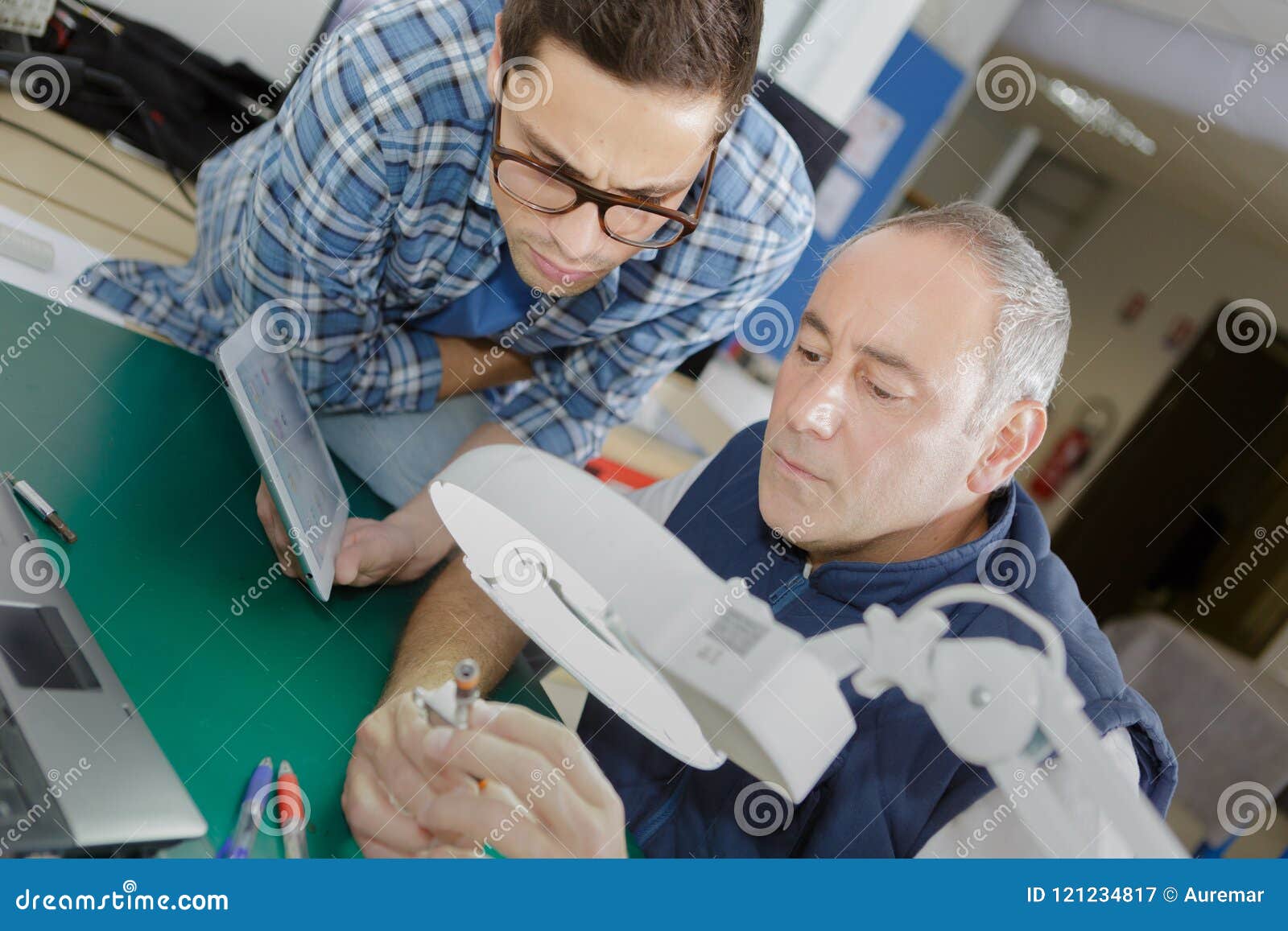 Electronics Engineer Observing Product Stock Image - Image of colleague ...
