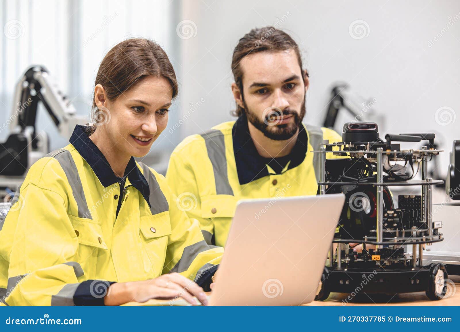 Electronics Engineer Team Works with IOT Robot Checking Source Code and ...